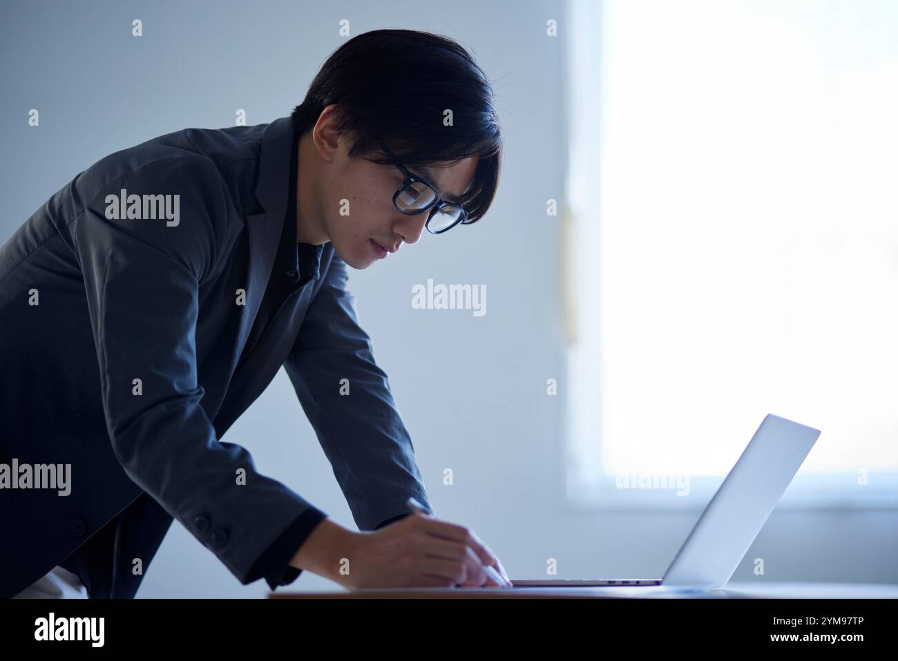 Japanese male architect designing in an architectural office Stock ...