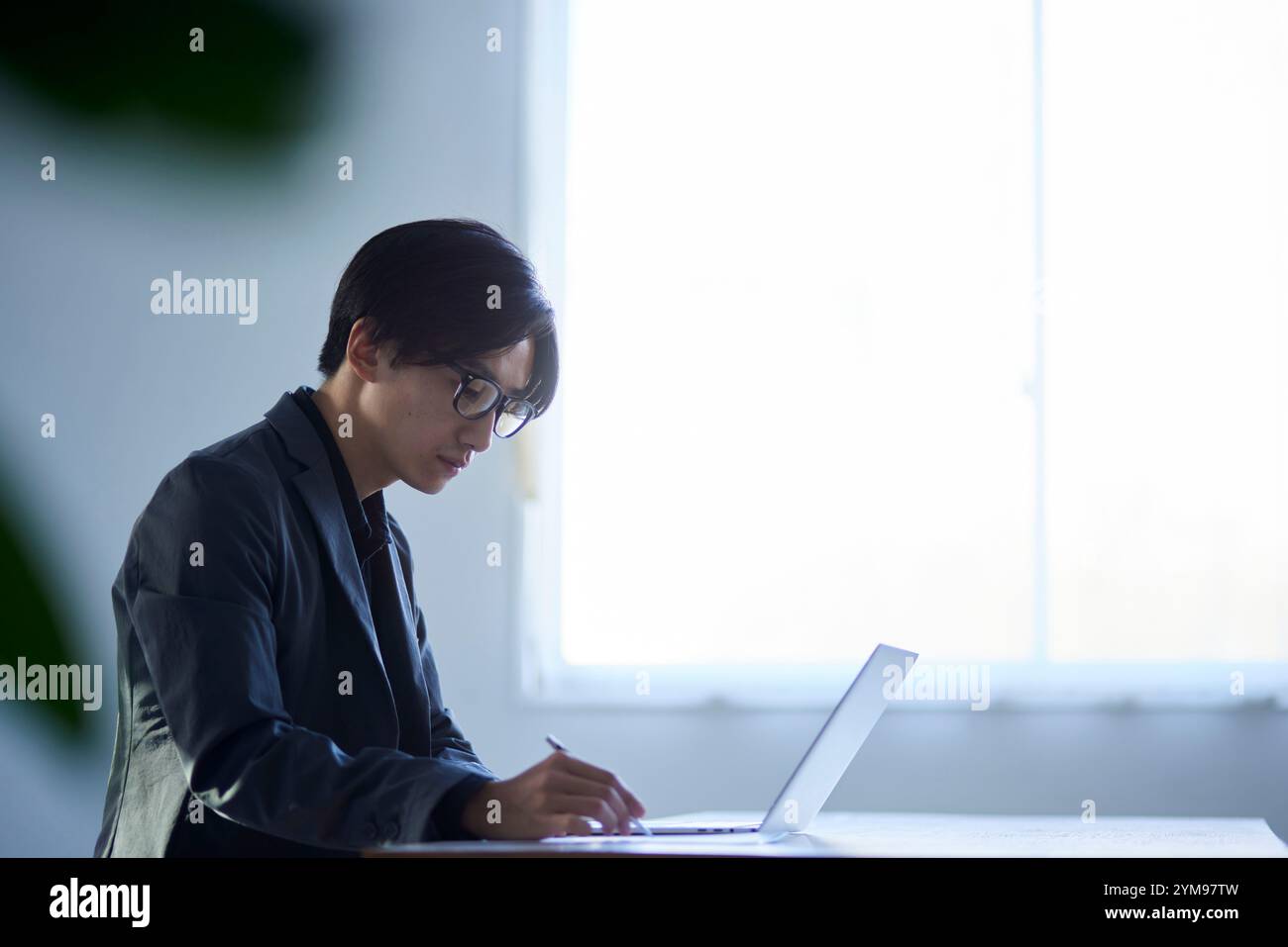 Japanese male architect designing in an architectural office Stock ...
