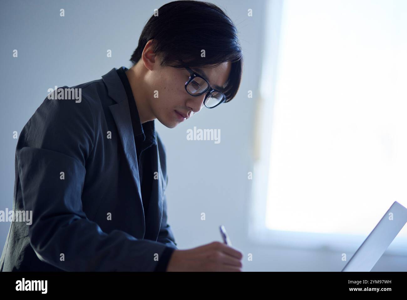 Japanese male architect designing in an architectural office Stock ...