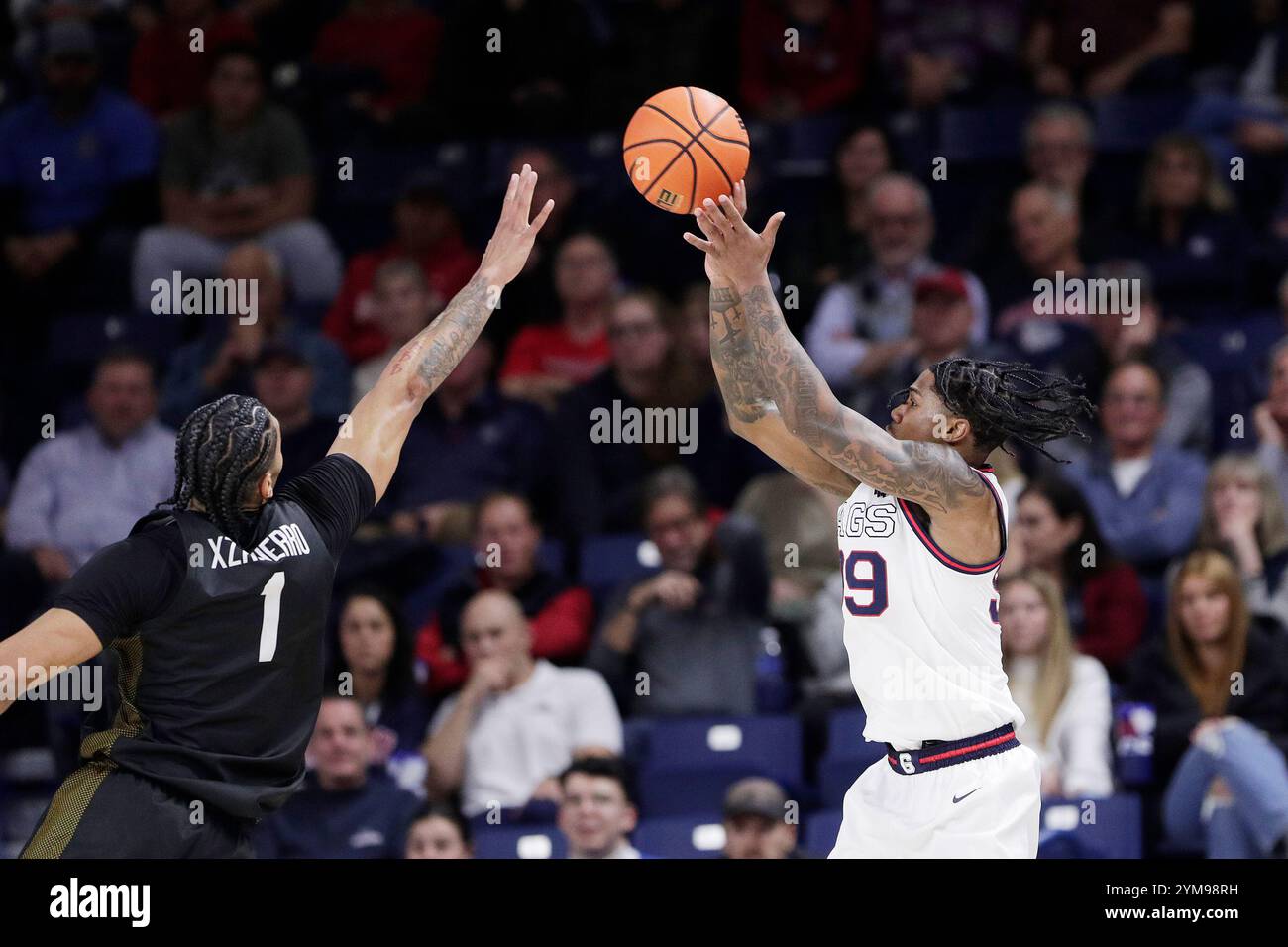 Gonzaga guard Khalif Battle, right, shoots while pressured by Long ...
