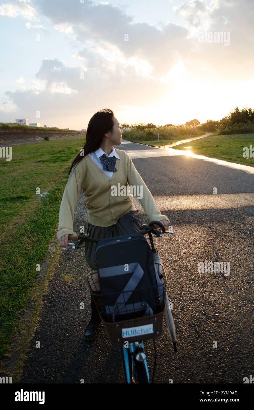 Female student looking backwards Stock Photo - Alamy