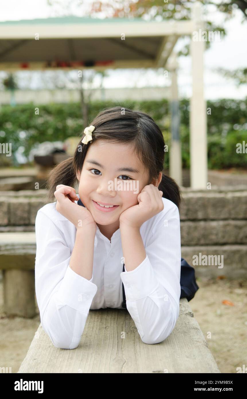 Primary schools girl laughing with cheekbones Stock Photo - Alamy