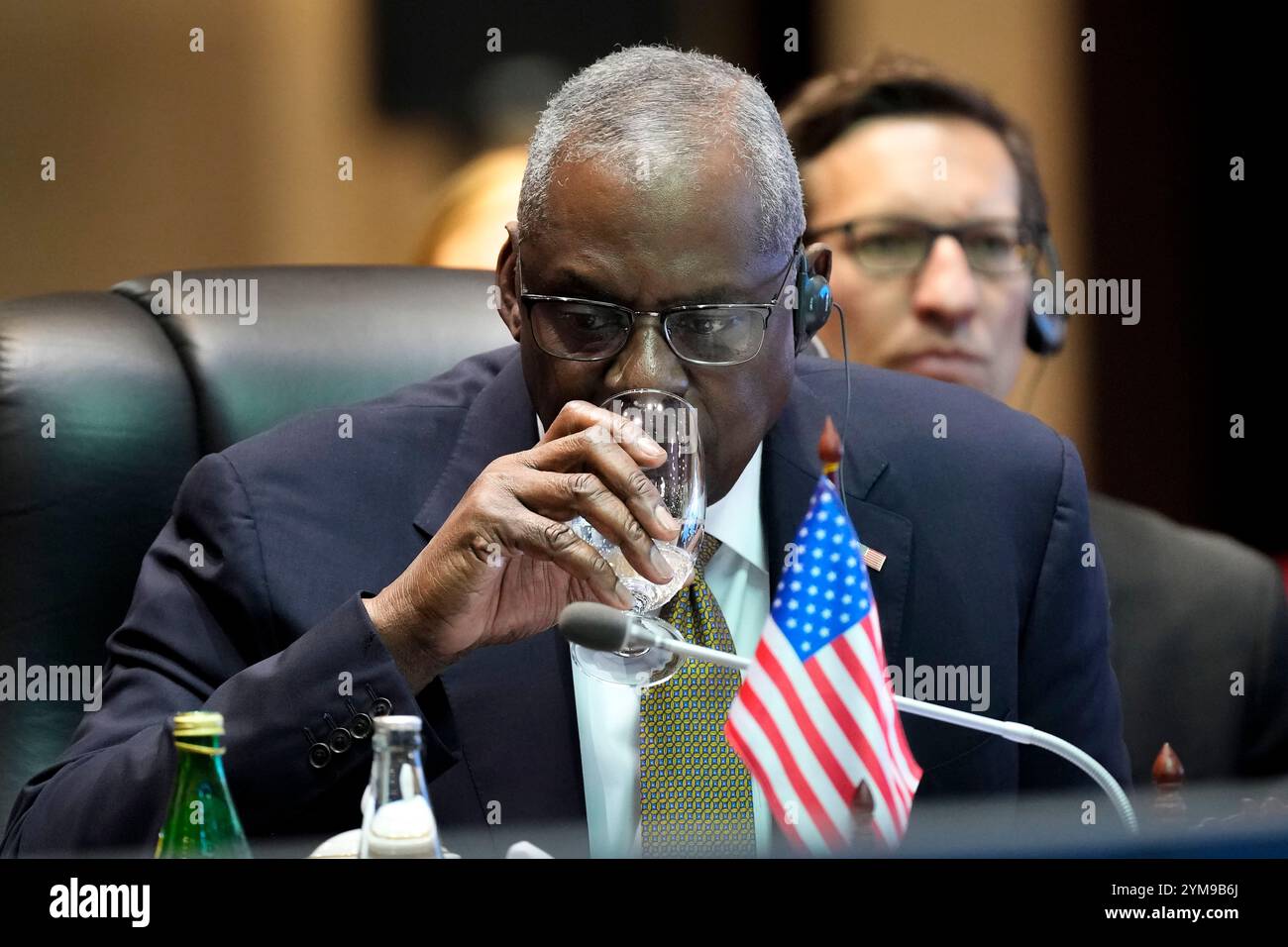 US Defense Secretary Lloyd Austin drinks water during the Association ...