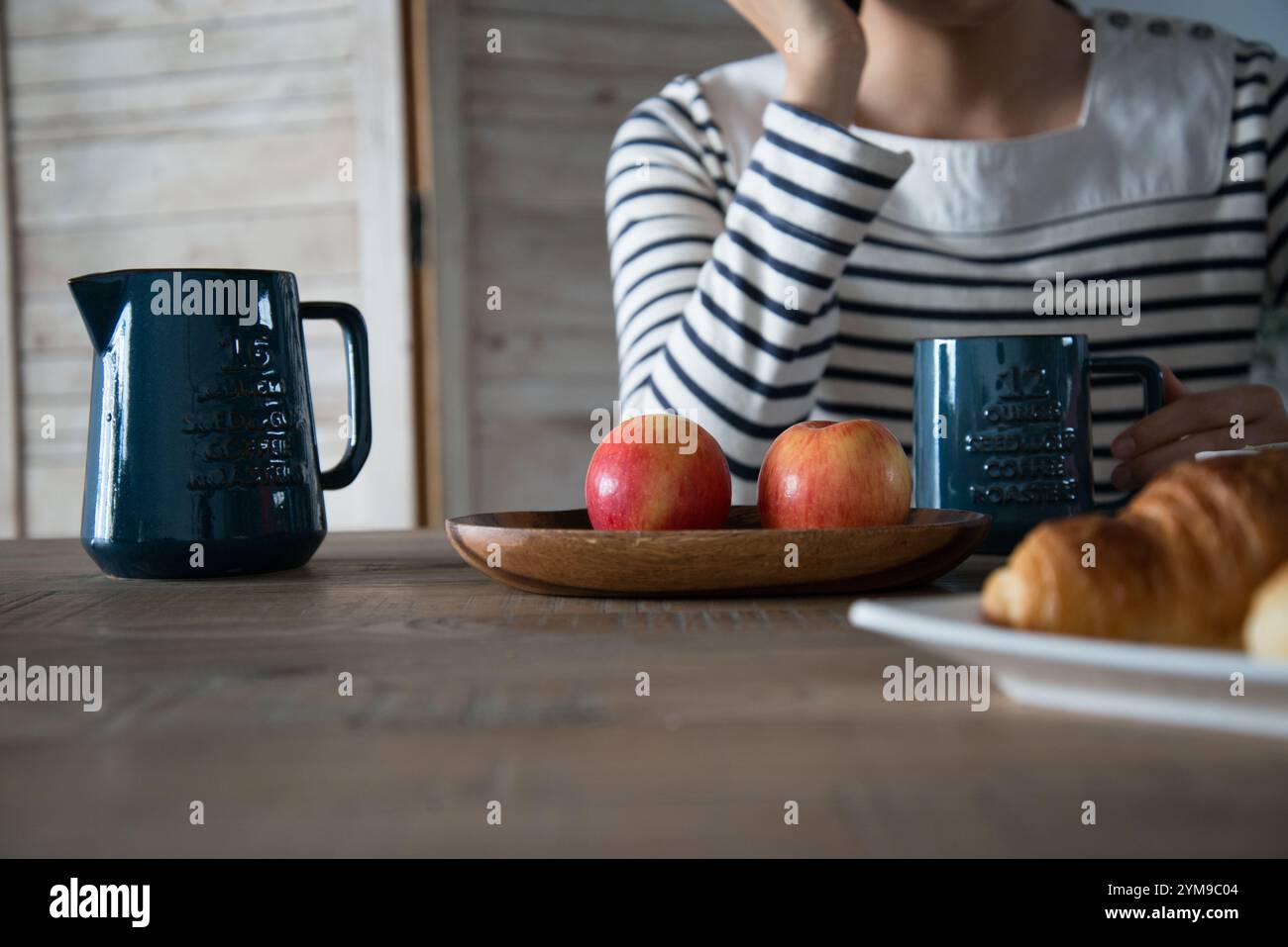 Breakfast scenery and woman's hand Stock Photo - Alamy