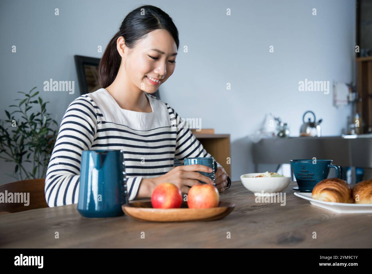 Breakfast scene and a woman Stock Photo - Alamy