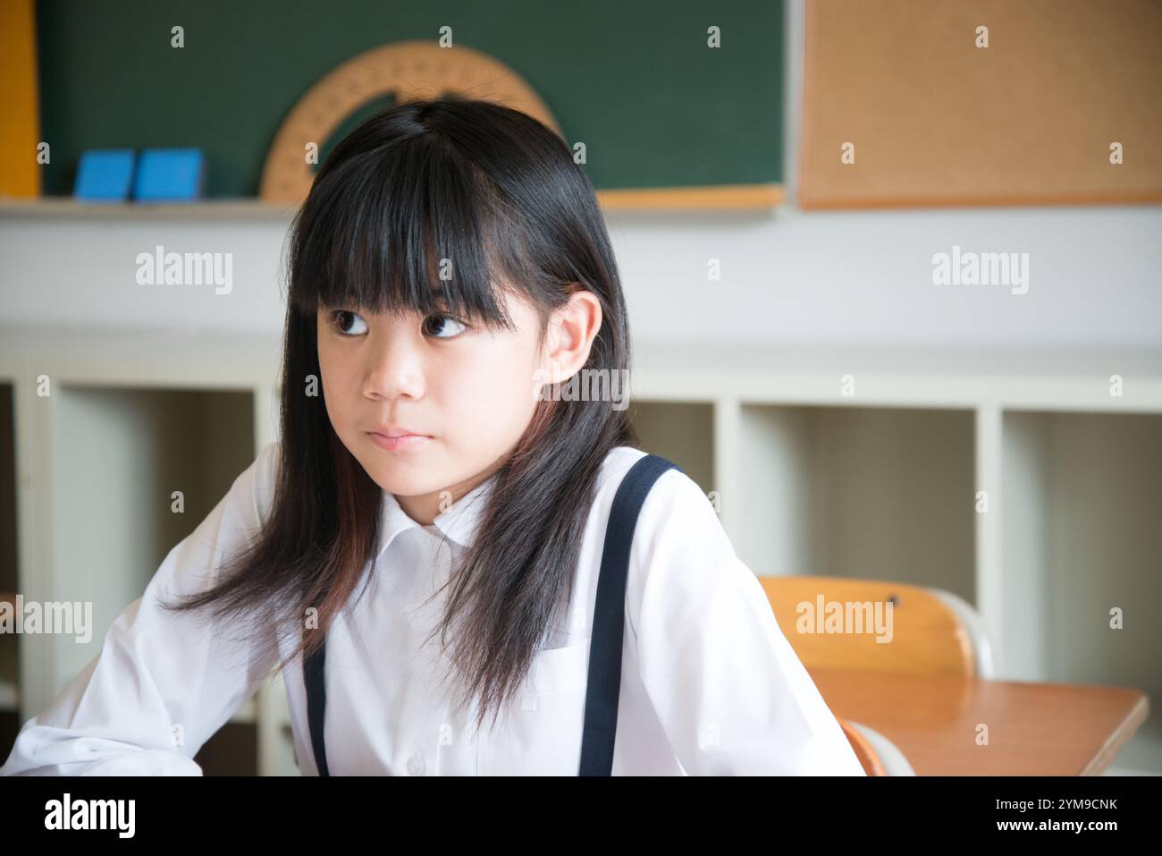 Primary school girls in school uniform in the classroom Stock Photo - Alamy