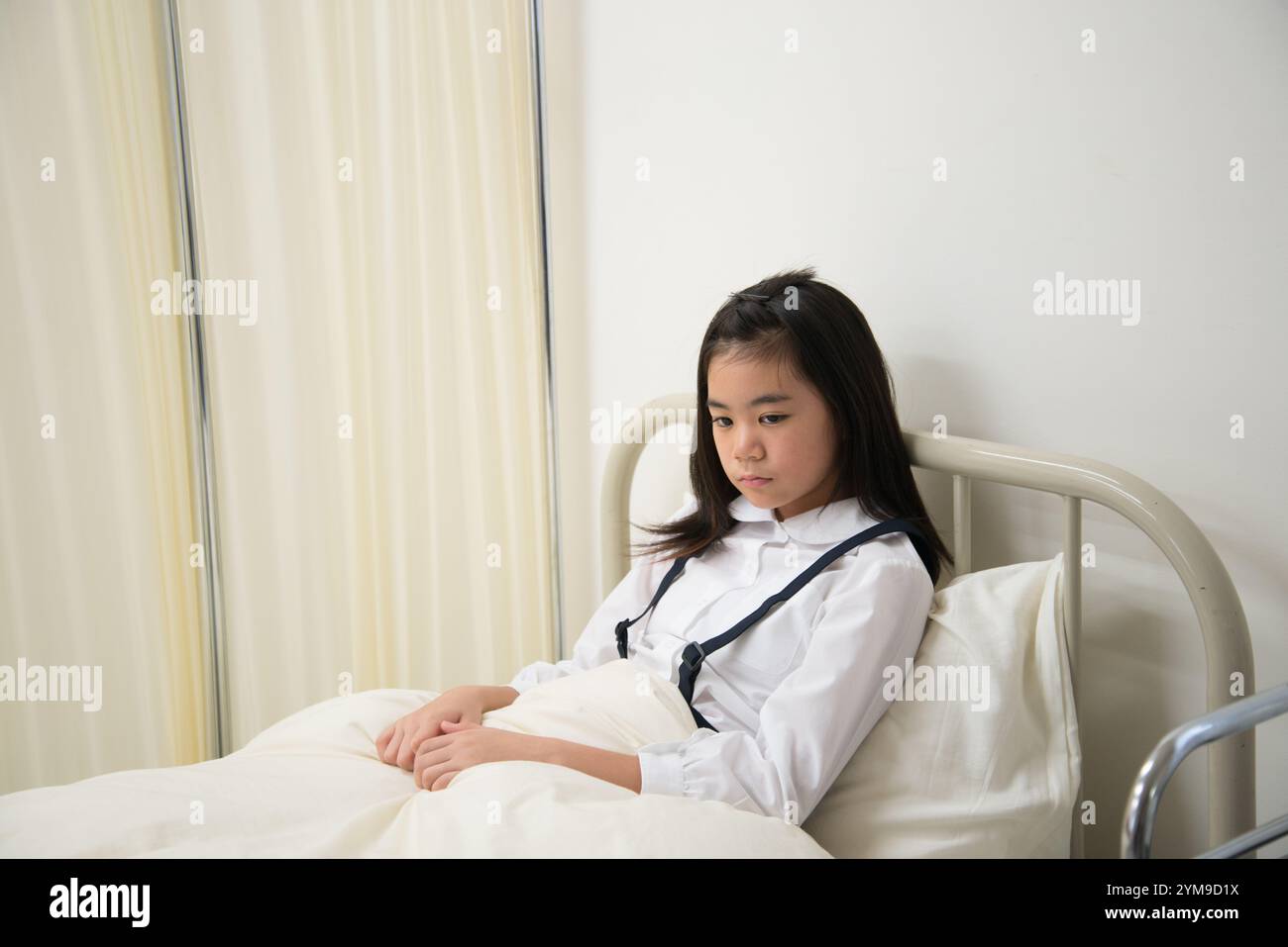 Primary school girl in bed in the infirmary Stock Photo - Alamy