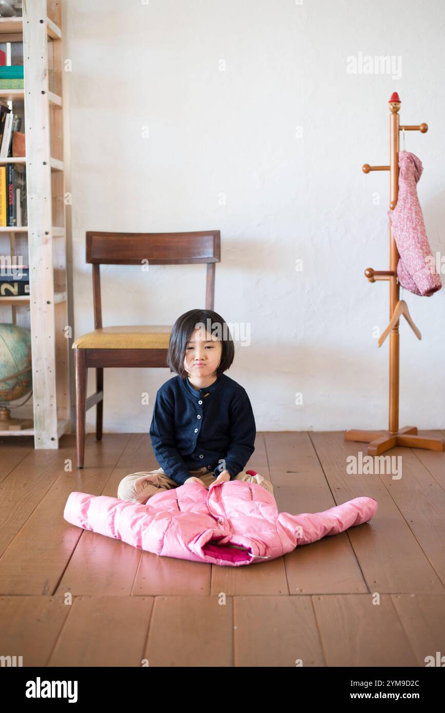 Jackets and girls on the floor Stock Photo - Alamy