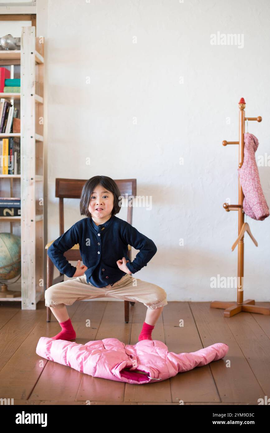 Jackets and girls on the floor Stock Photo - Alamy