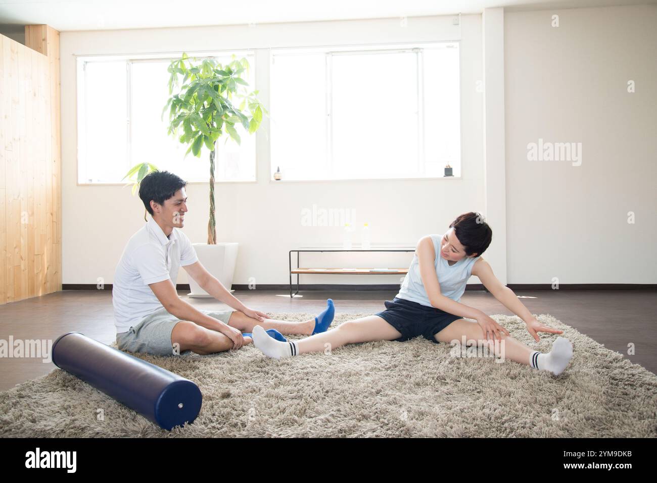 Trainer stretching hi-res stock photography and images - Alamy