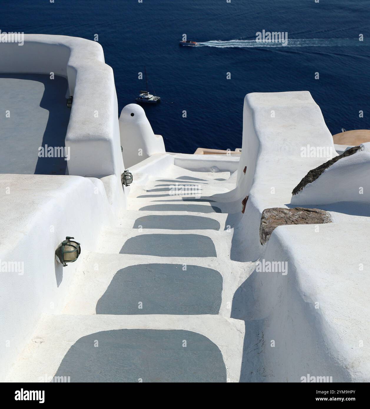 Village steps in Santorini, Greece with view of the mediterranean sea ...