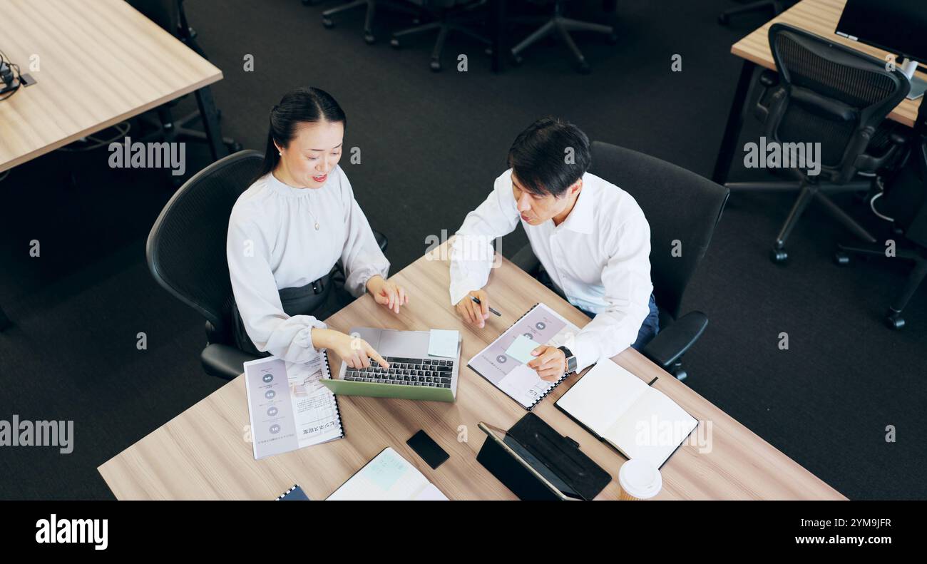 Teamwork, meeting and laptop with business people in Japanese office for proposal, workshop and ...