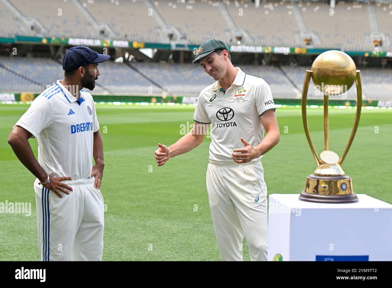 Pat Cummins Captain of Australia (R) speaks with Jasprit Bumrah Captain ...