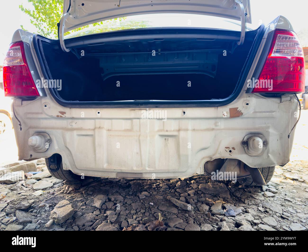 Car rear bumper removed showing trunk and frame Stock Photo - Alamy