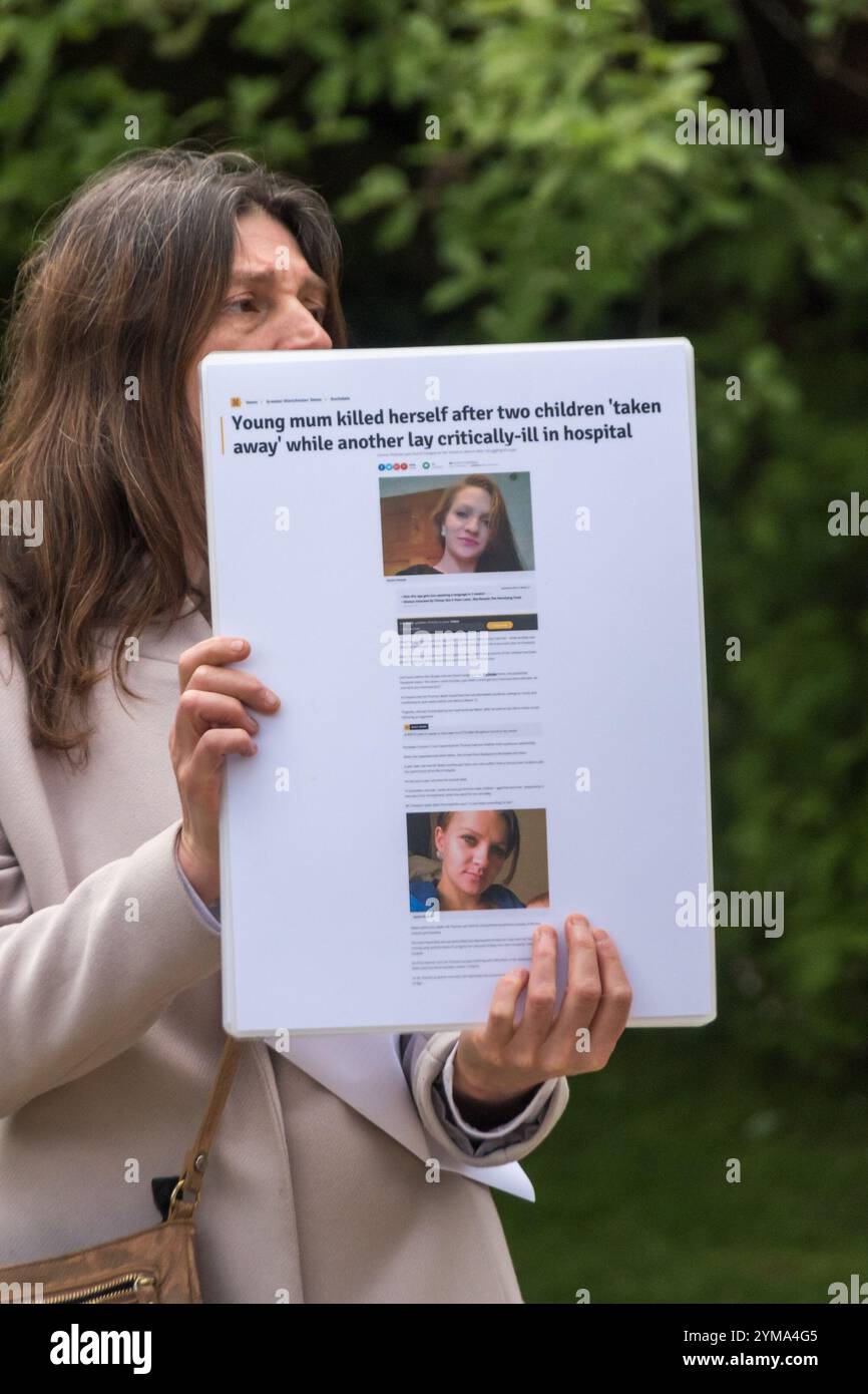 London, UK. 22nd April, 2017. A woman holds up a poster with press ...