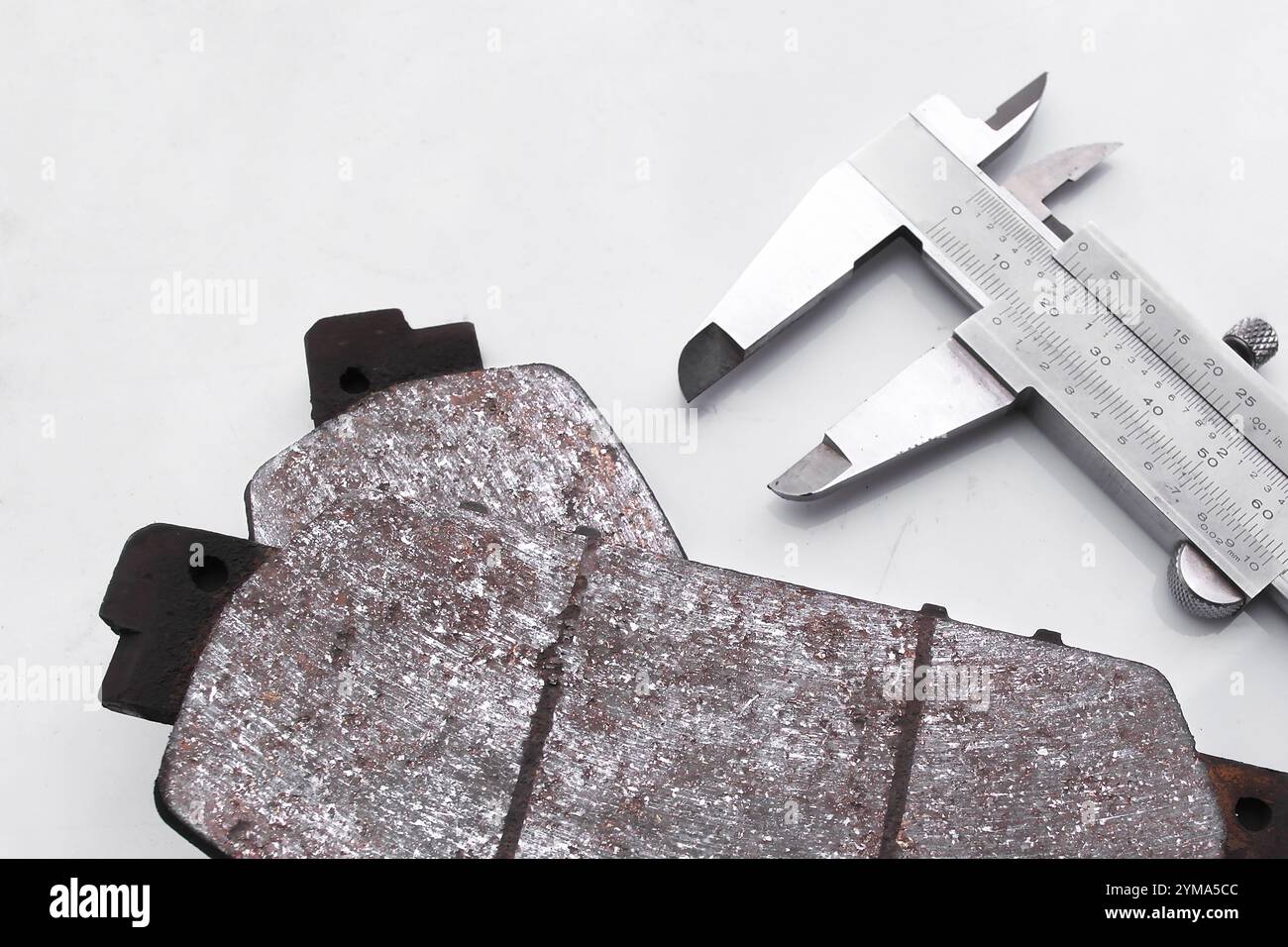 Precision measurement of brake pad with vernier caliper , Car ...