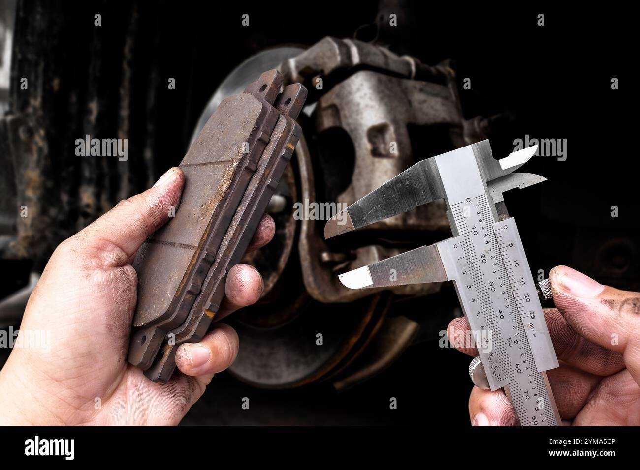 Precision measurement of brake pad with vernier caliper by auto ...