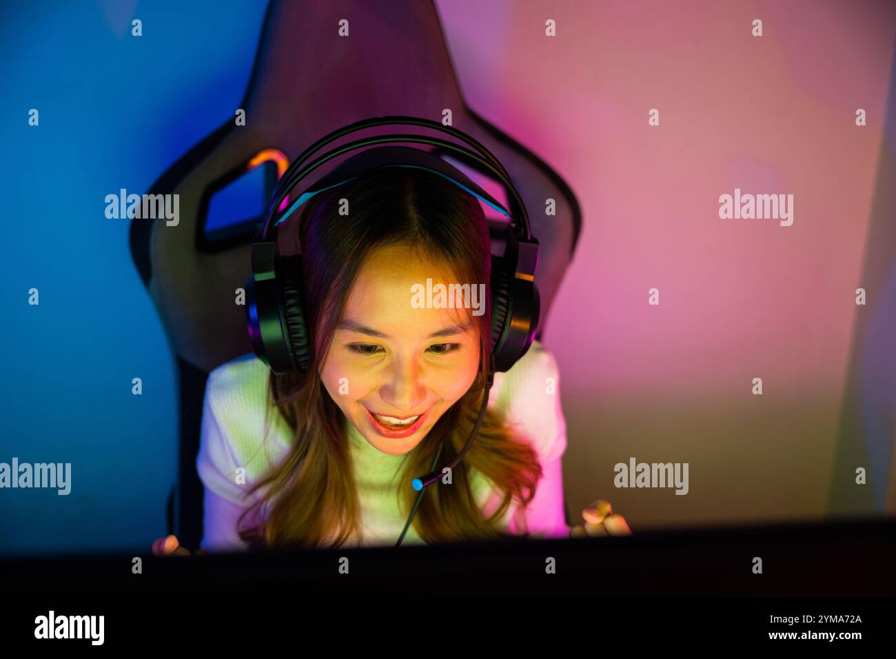 Asian happy Gamer endeavor plays online video games tournament with ...