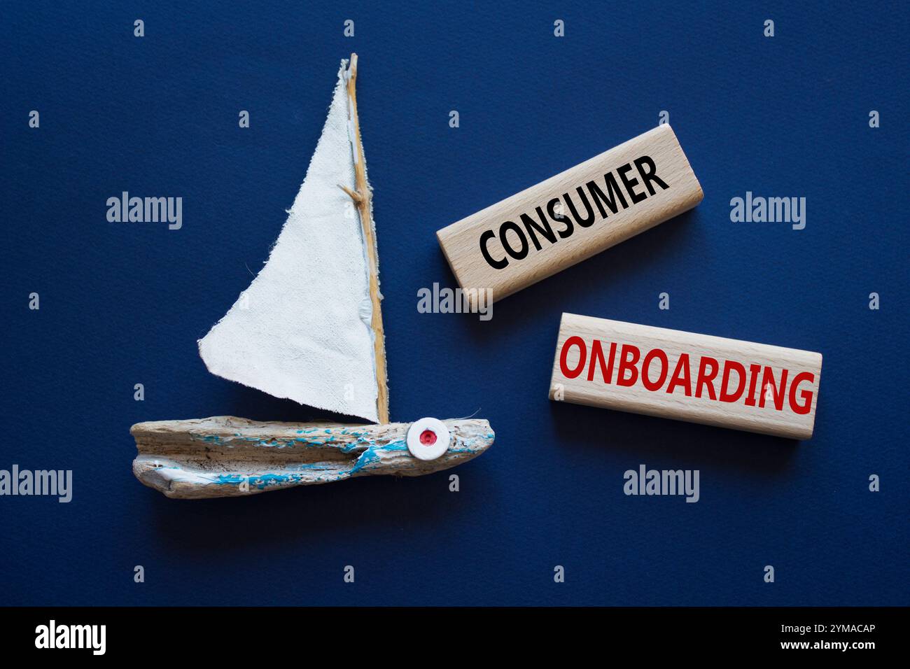 Consumer Onboarding symbol. Wooden blocks with words Consumer ...