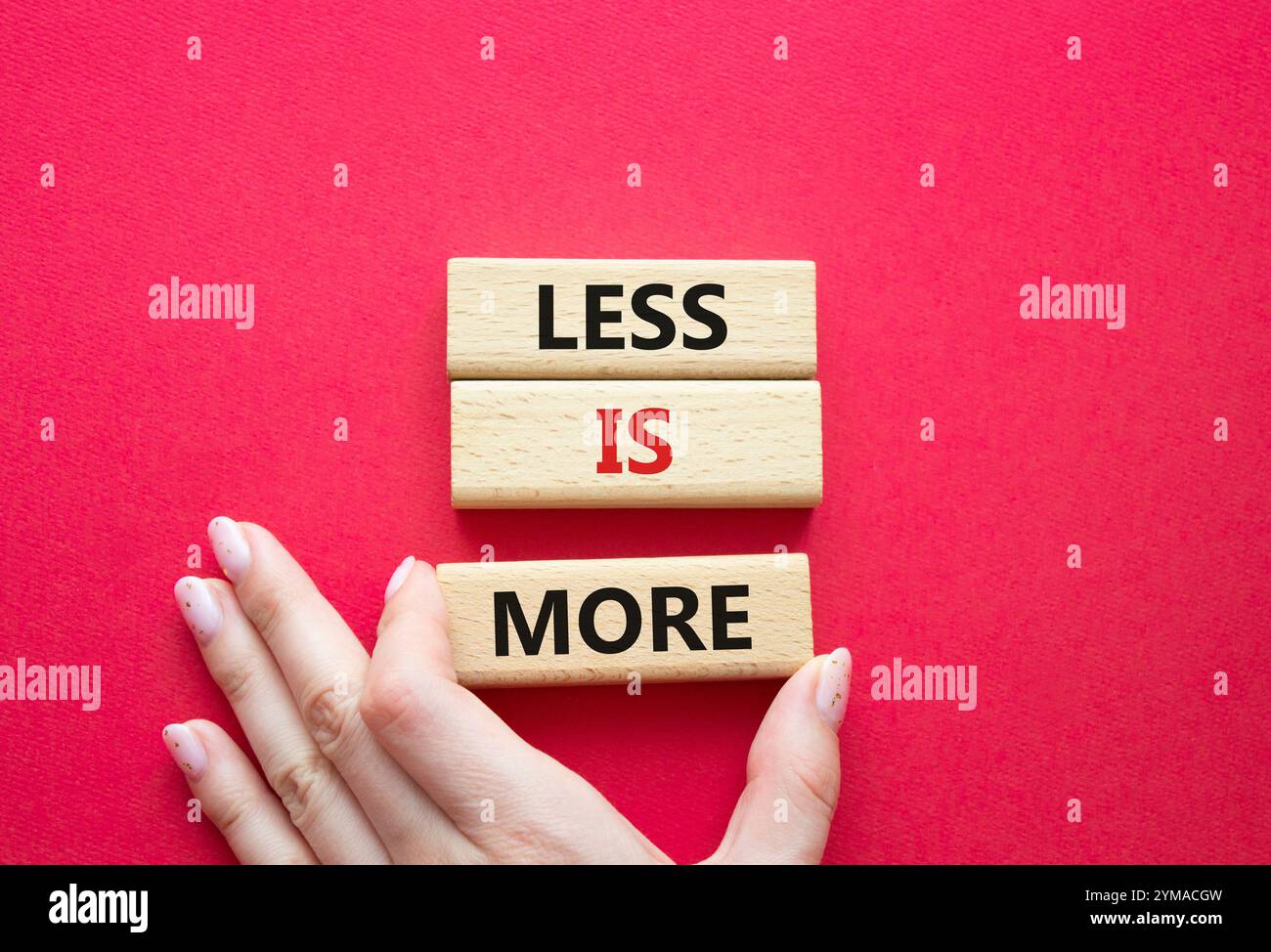 Less is More symbol. Concept words Less is More on wooden blocks ...