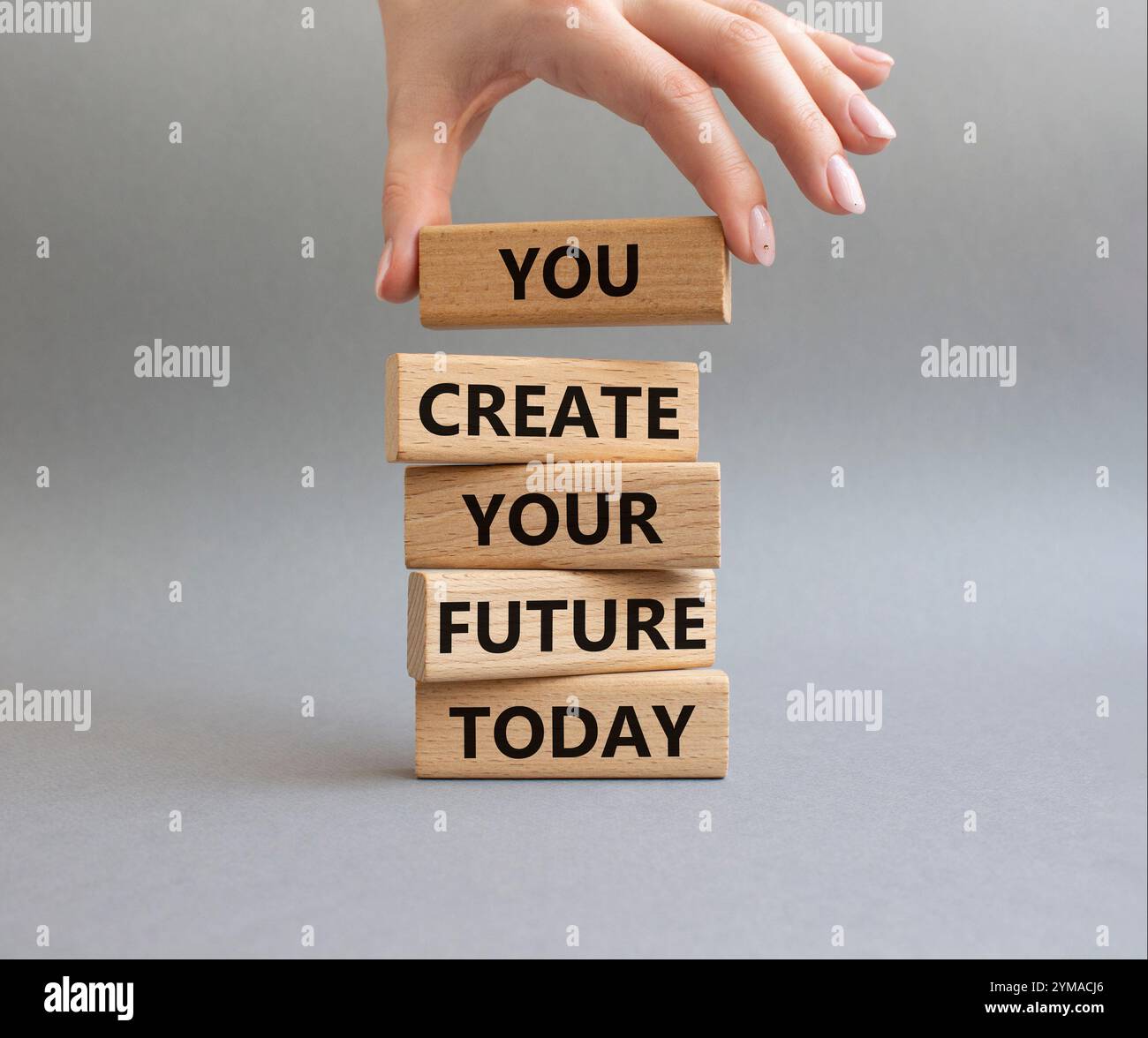 Future and development symbol. Wooden blocks with words You Create your ...