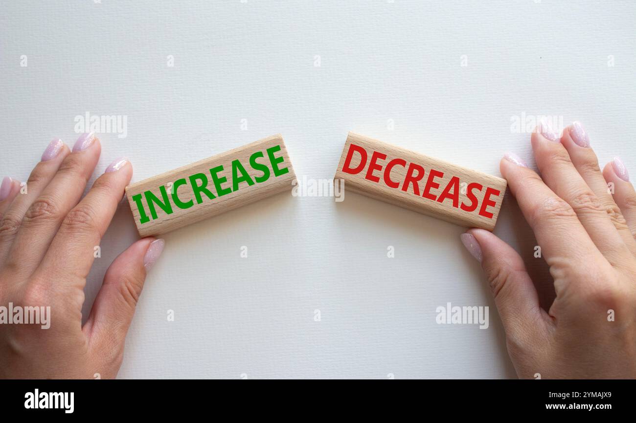 Increase or Decrease symbol. Concept word Increase or Decrease on wooden blocks. Businessman ...