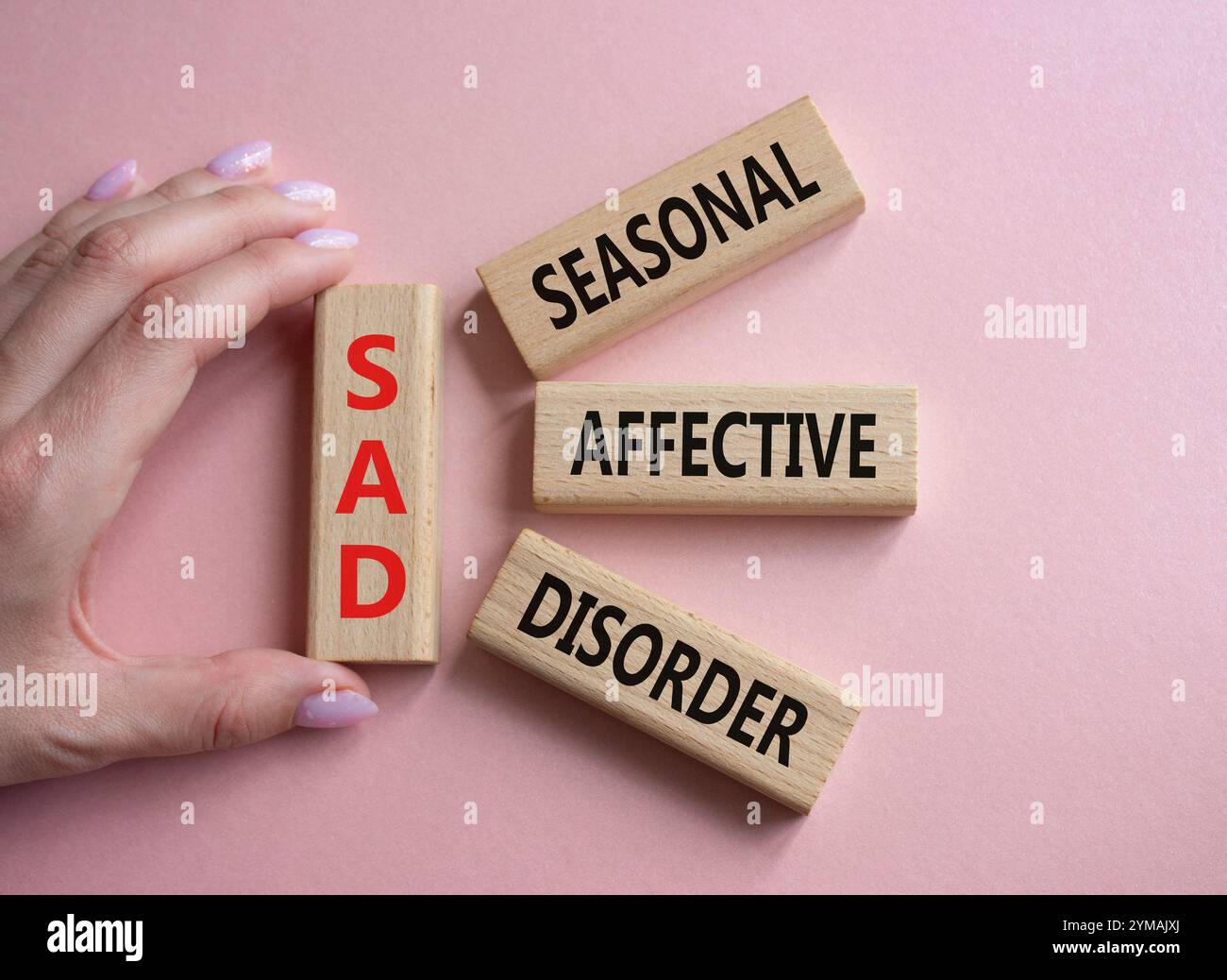 Sad - Seasonal Affective Disorder symbol. Wooden blocks with words Sad ...
