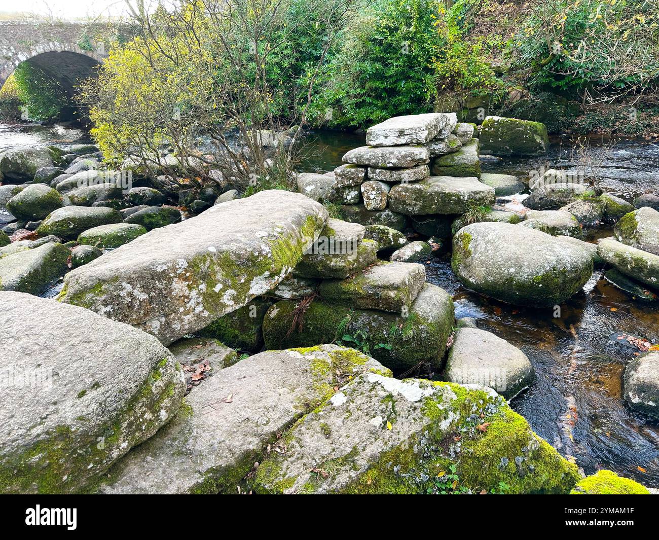 The humpback bridge and ruined ancient stone clapper bridge at Dartmeet ...