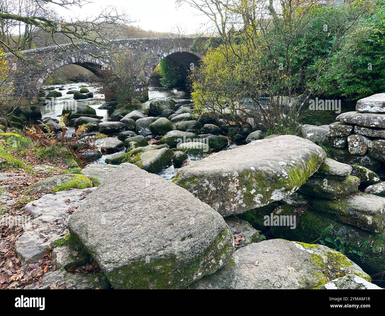 The humpback bridge and ruined ancient stone clapper bridge at Dartmeet ...