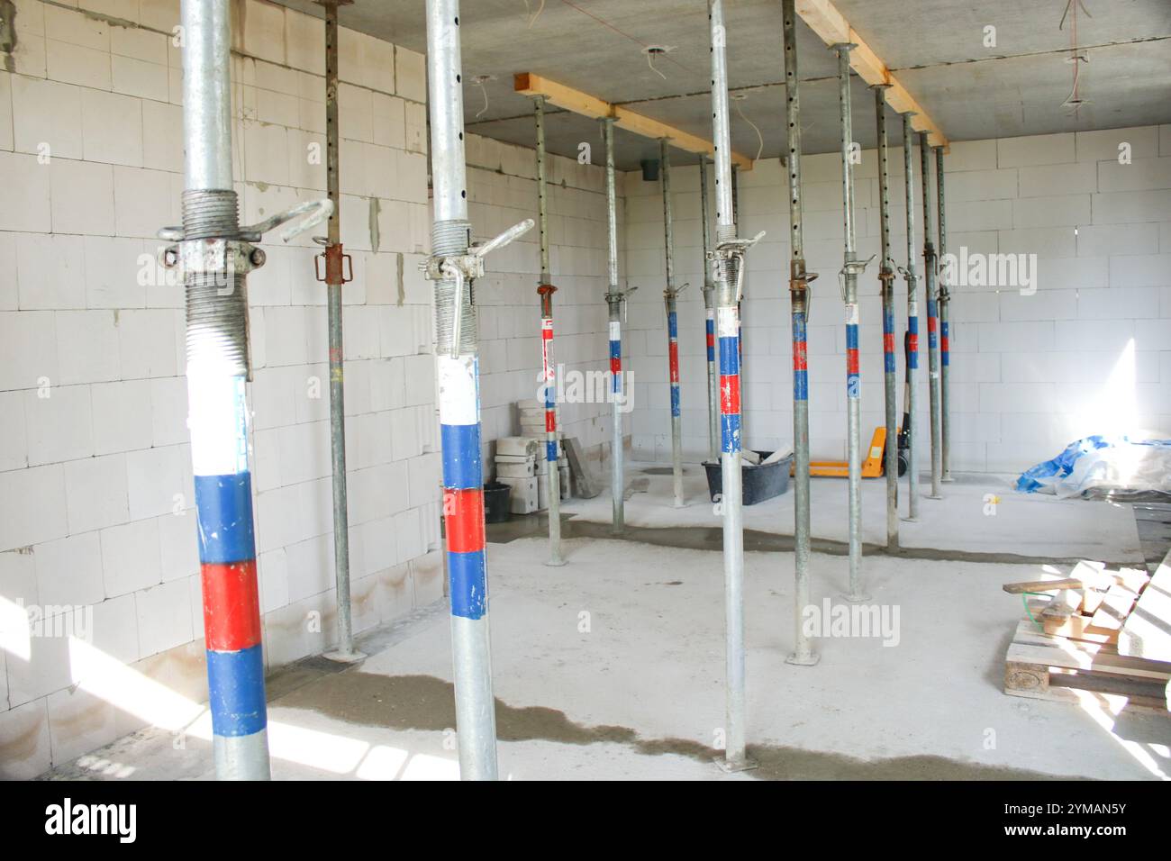 Inside view of a new building with white stone walls concrete and ...