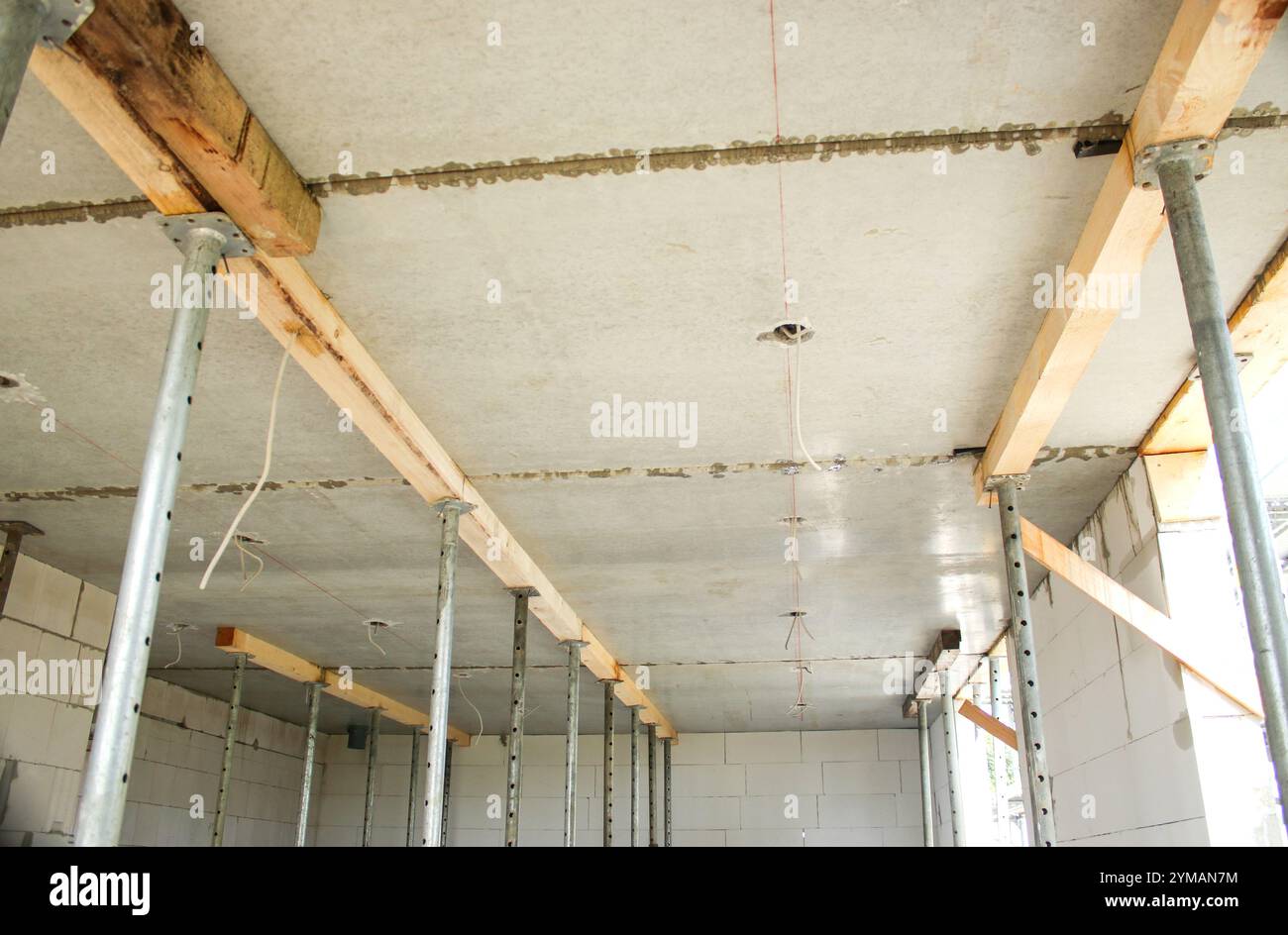Inside view of a new building with white stone walls concrete and ...