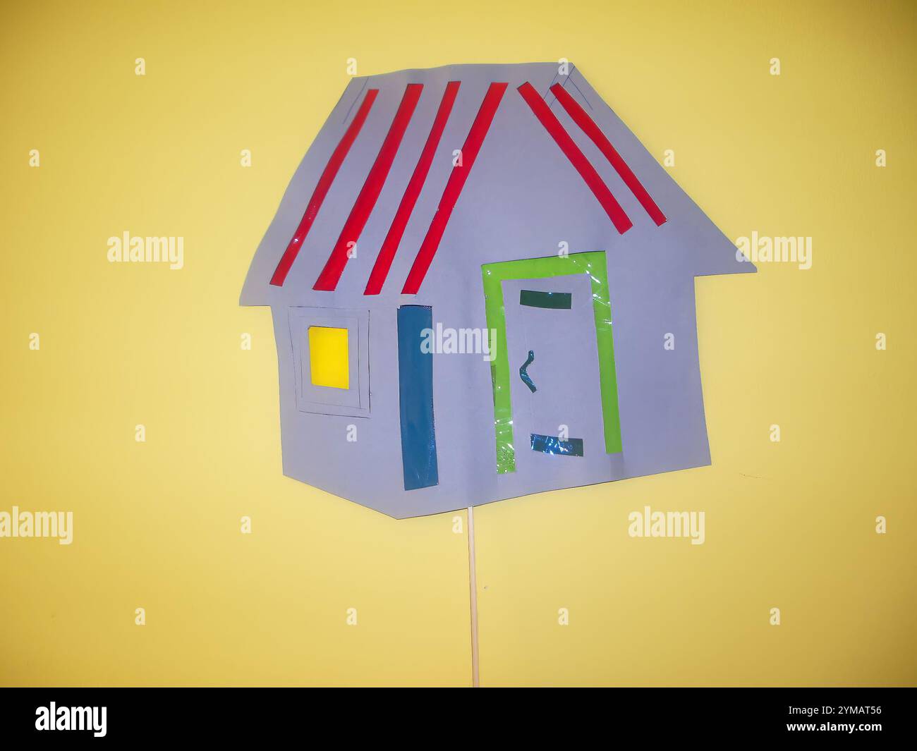 Illustration of a house made of paper and other colored materials ...