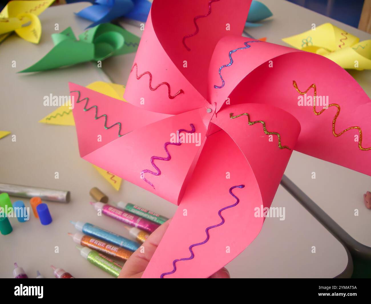 Several pink pinwheels made from paper. Several pink pinwheels made ...