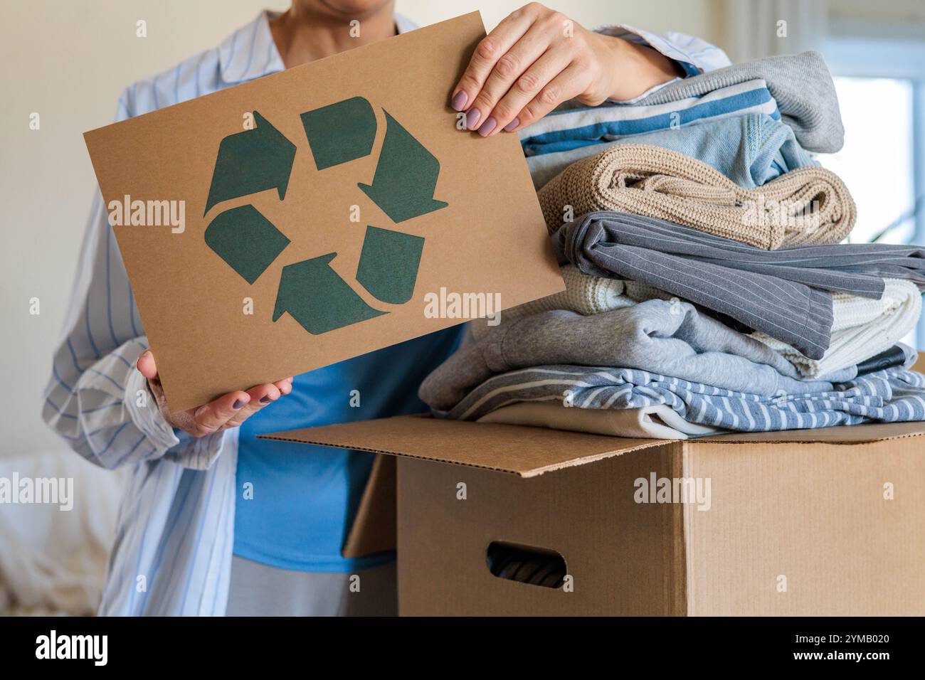 Female hands holding signboard textile clothes recycling reusing zero ...