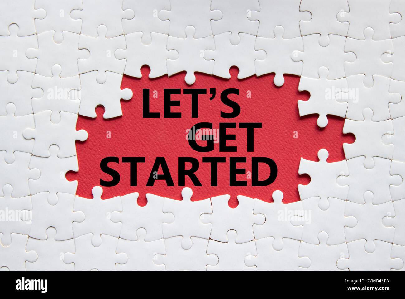 Lets get started symbol. Concept words Lets get started on white puzzle ...