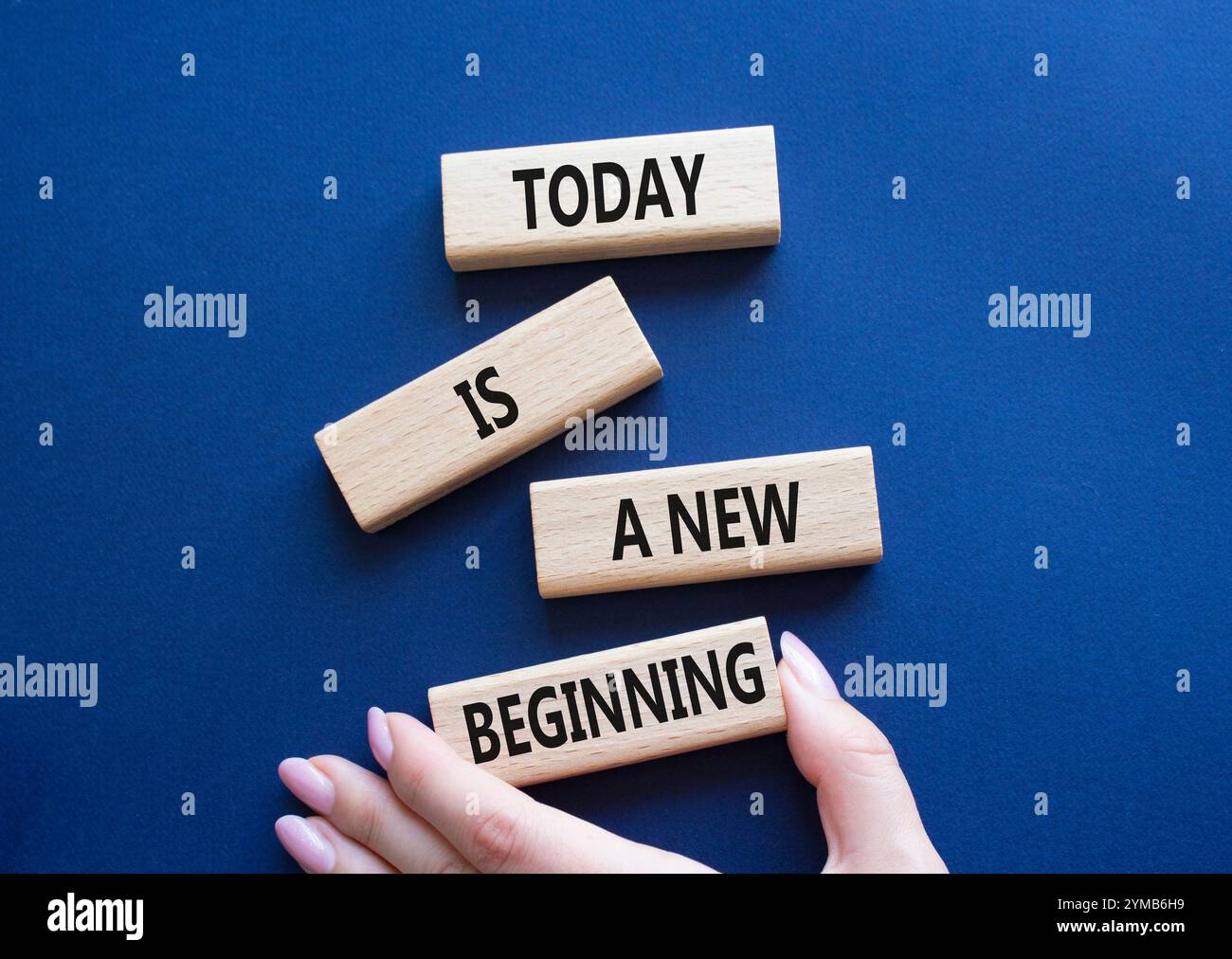 Today is a new beginning symbol. Wooden blocks with words Today is a ...