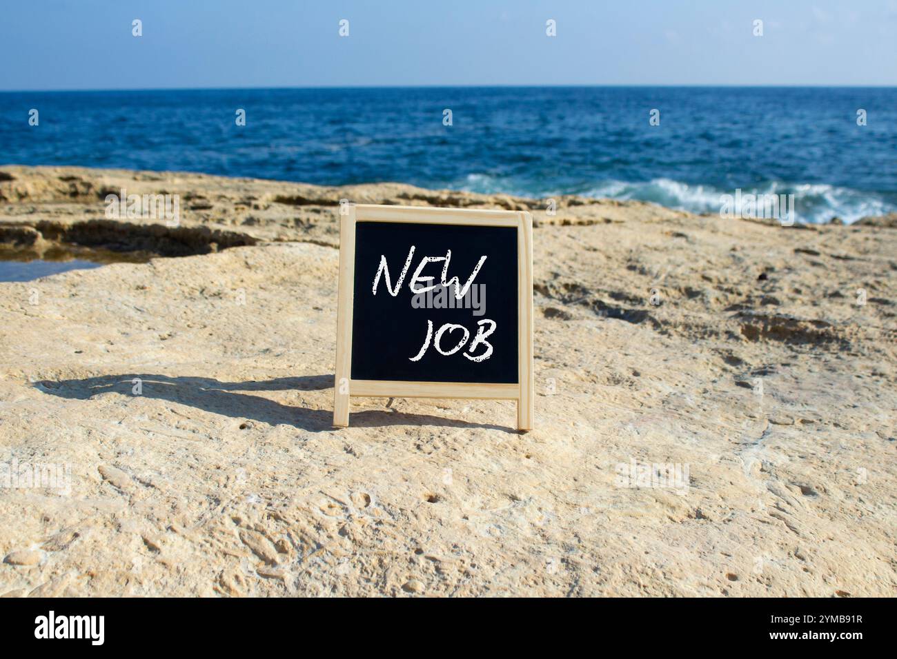 New job symbol. Concept words New job on black chalk background ...