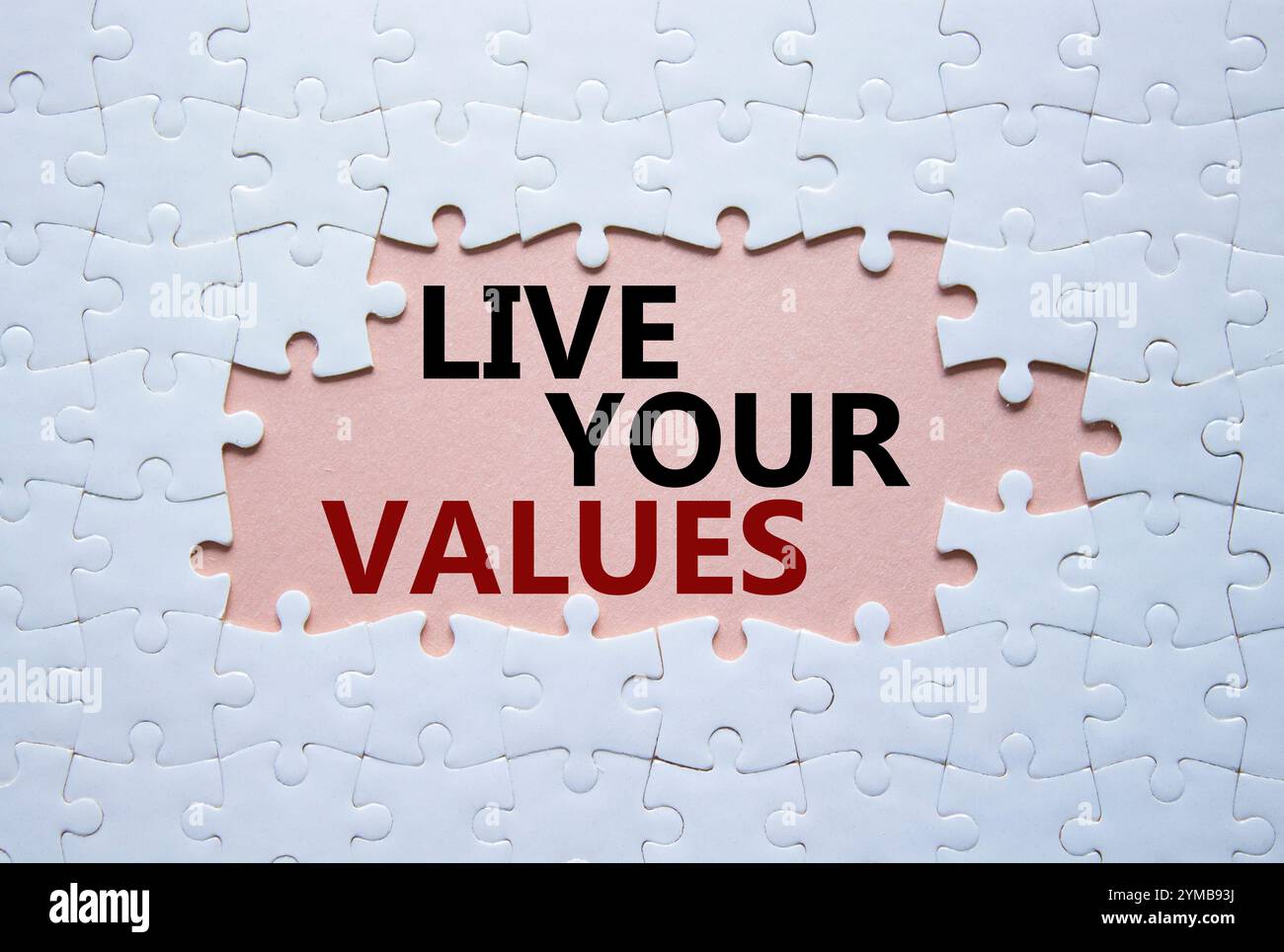 Live your values symbol. Concept words Live your values on white puzzle. Beautiful pink ...