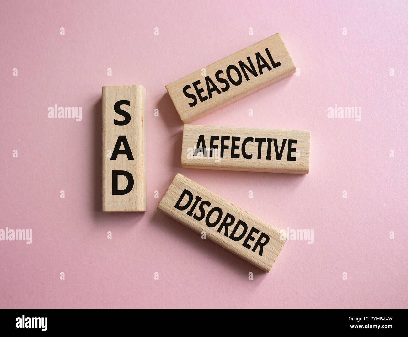 Sad - Seasonal Affective Disorder symbol. Wooden blocks with words Sad ...