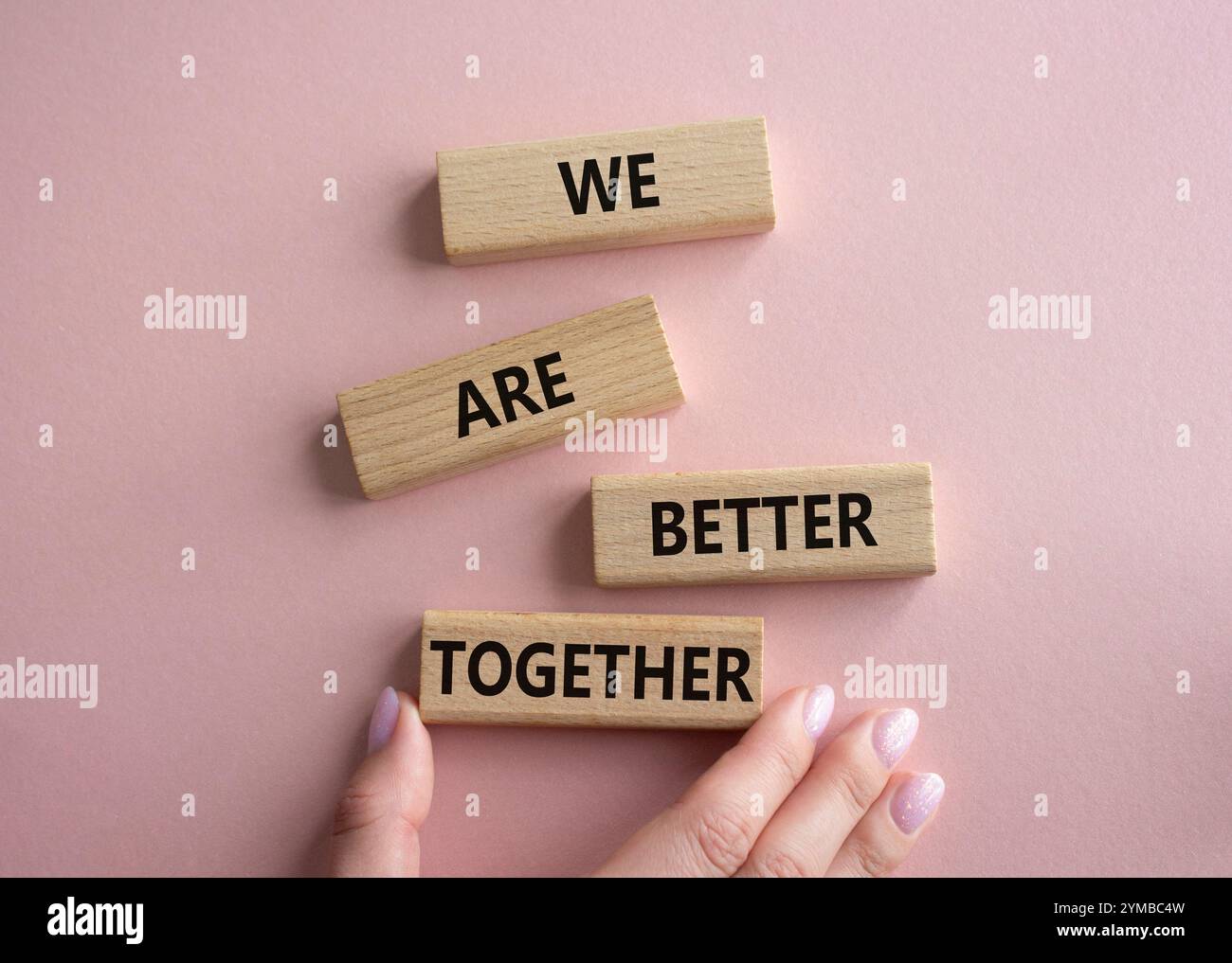 We are better together symbol. Wooden blocks with words We are better ...