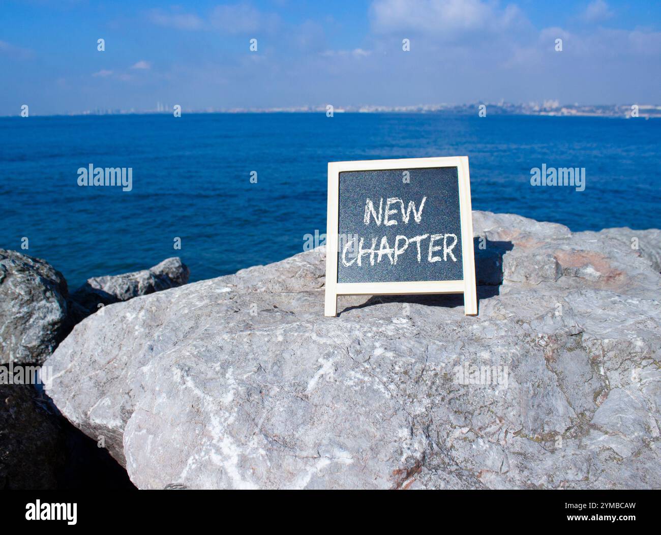 New Chapter symbol. Concept word New Chapter on black chalk background ...