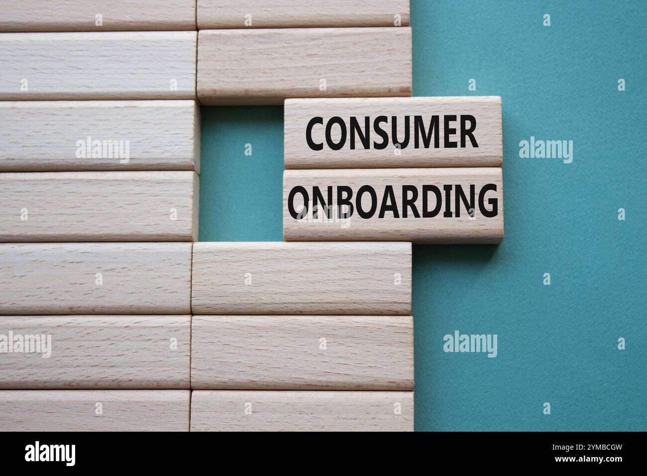 Consumer Onboarding symbol. Wooden blocks with words Consumer ...