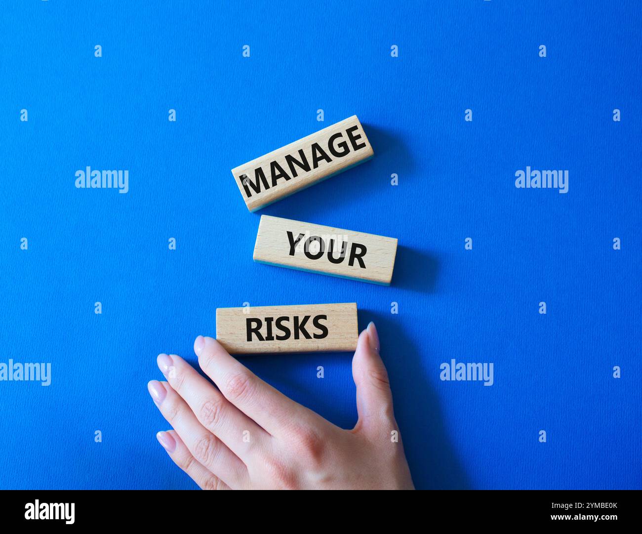Manage your Risks symbol. Concept words Manage your Risks on wooden ...