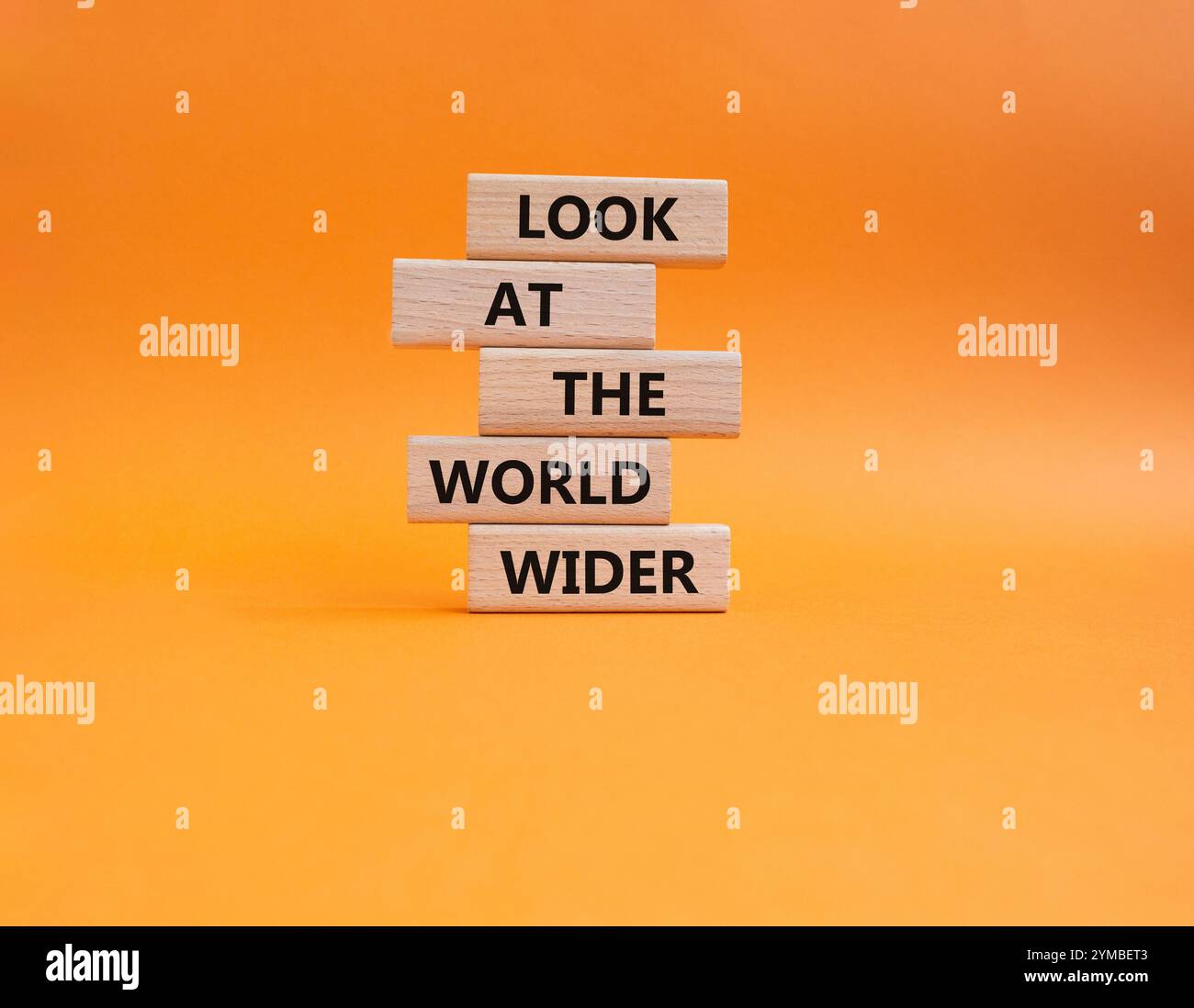 Look at the world wider symbol. Wooden blocks with words Look at the ...