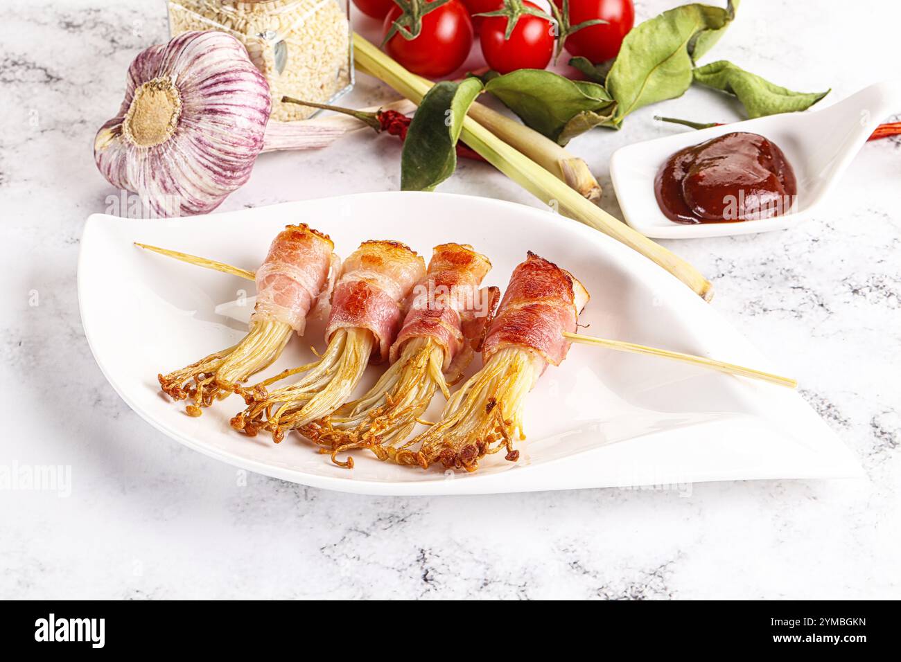 Tasty Grilled enoki mushroom with bacon Stock Photo - Alamy