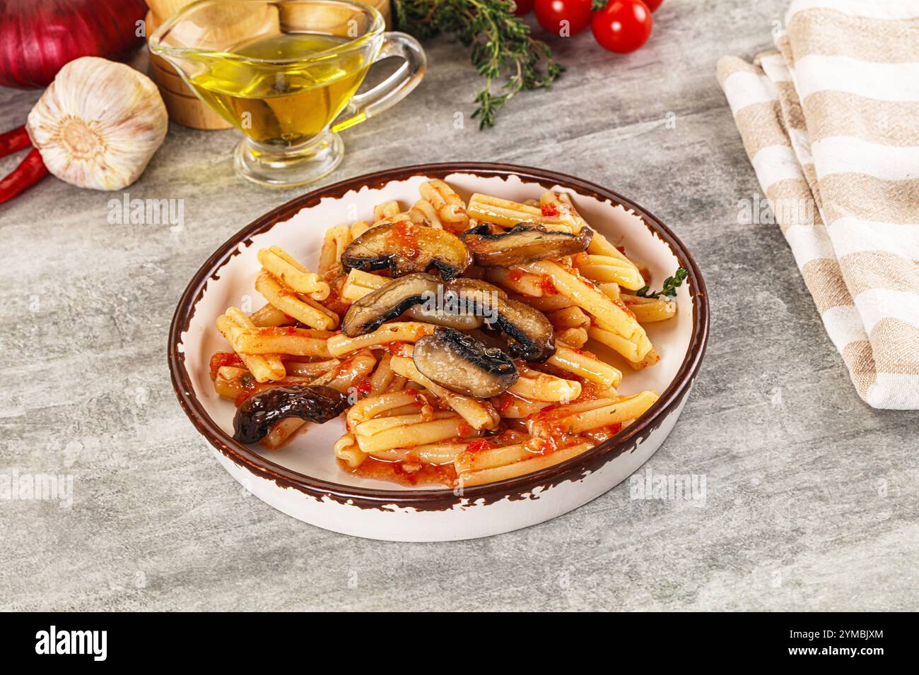 Italian cuisine - pasta casafecce with mushrooms Stock Photo - Alamy