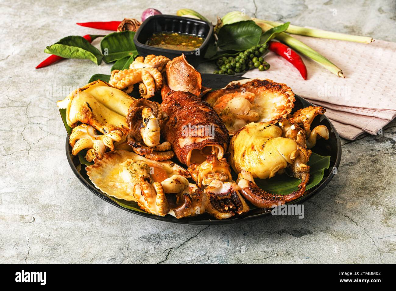 Asian grilled seafood mix plate - squid, cuttlefish, scallops and ...