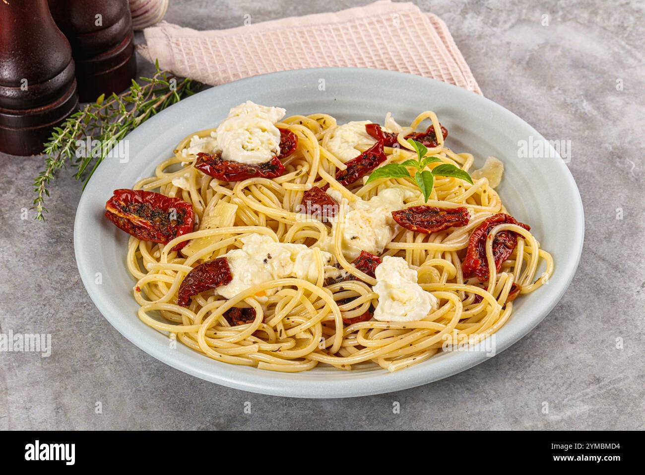 Italian pasta spaghetti with stracciatella and tomato Stock Photo - Alamy