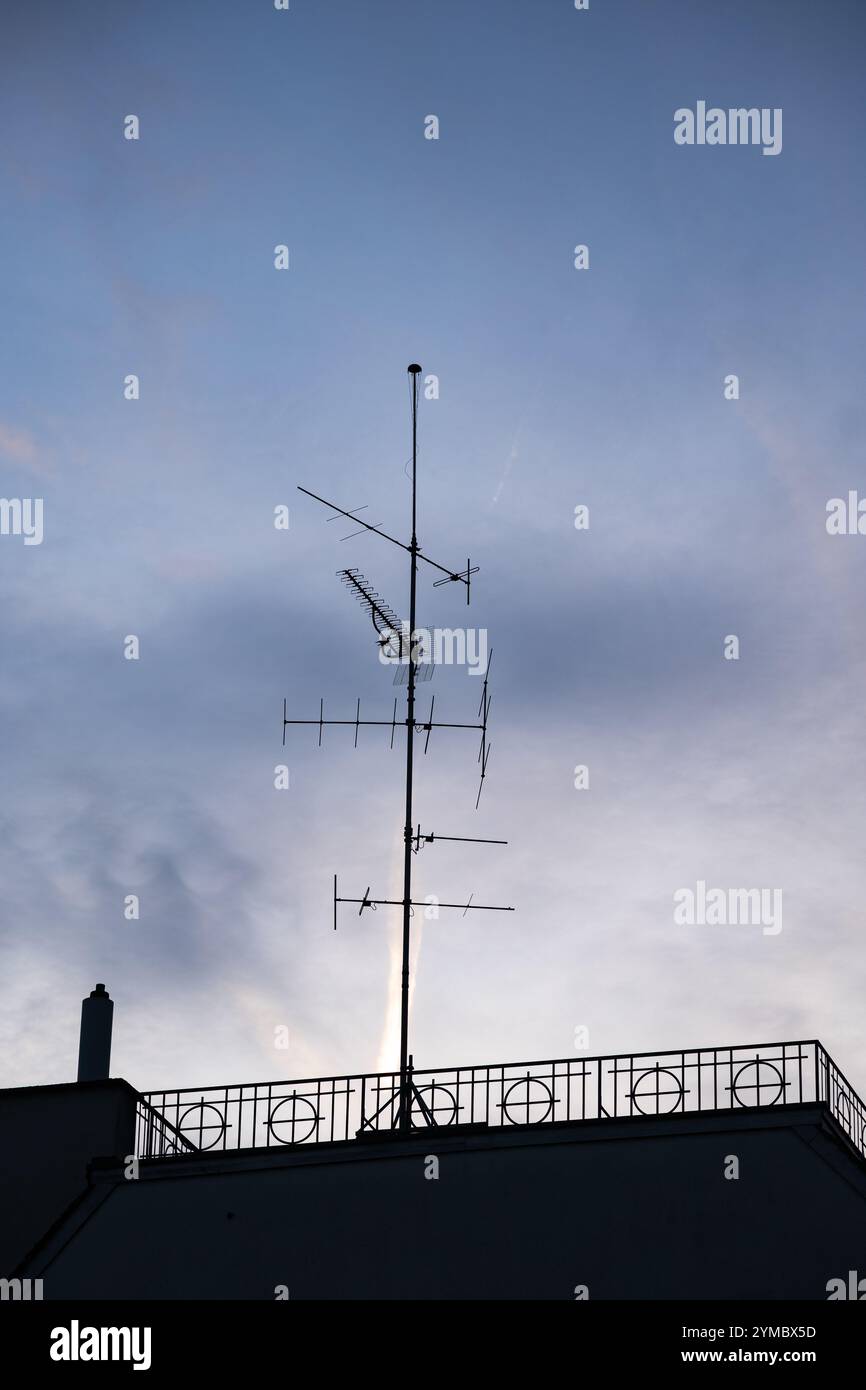 Rooftop mounted, old, TV signal capturing antenna on a residential ...