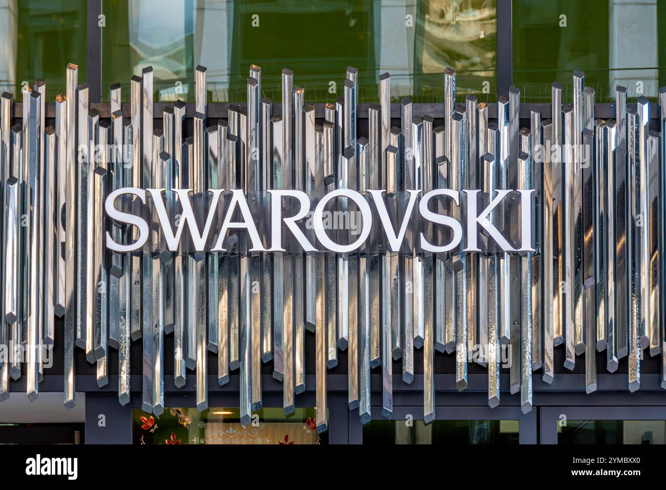 Sign and logo of a Swarovski store. Swarovski is an Austrian company ...
